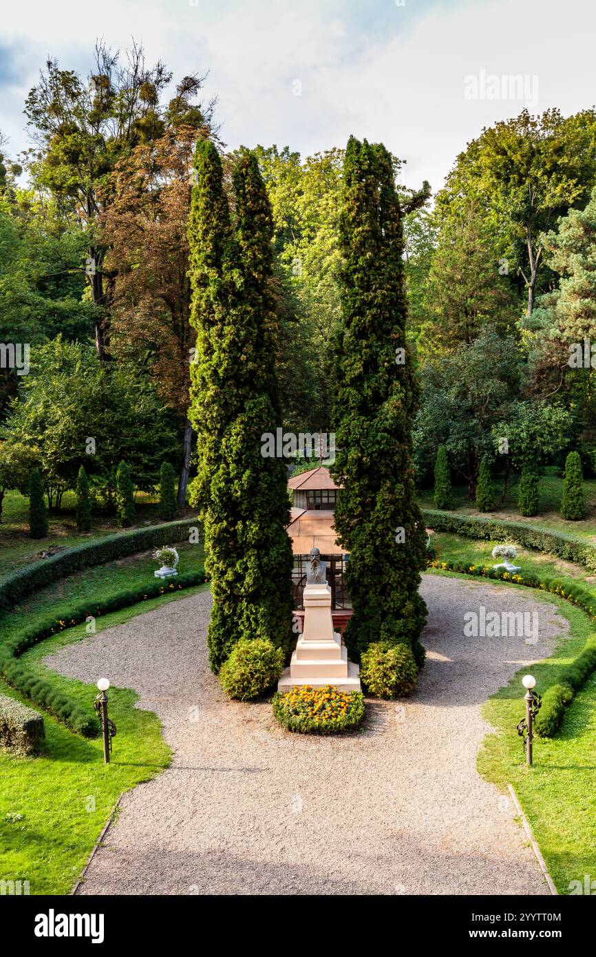 A path with a stone walkway and a small stone structure in the middle ...