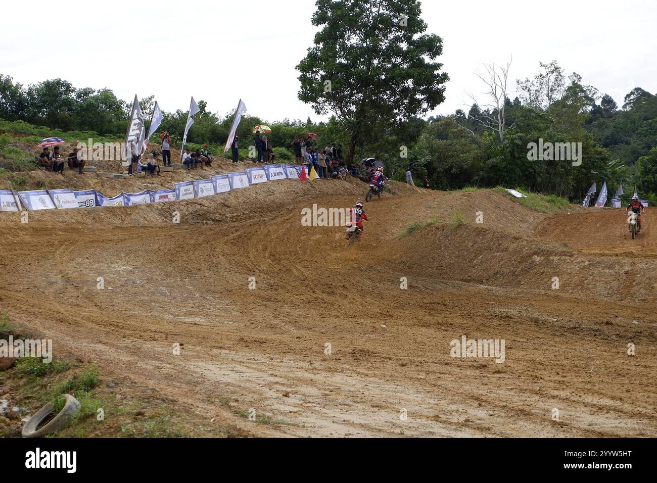 Motocross racers in action on the motocross racing circuit Stock Photo ...