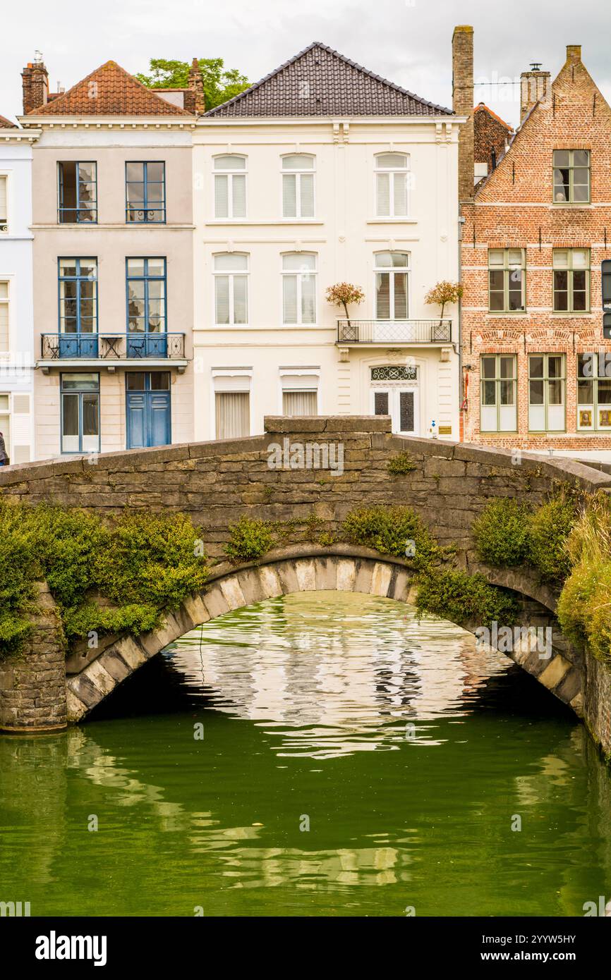 Stone bridge over canal scene, Bruges, West Flanders, Belgium Stock ...