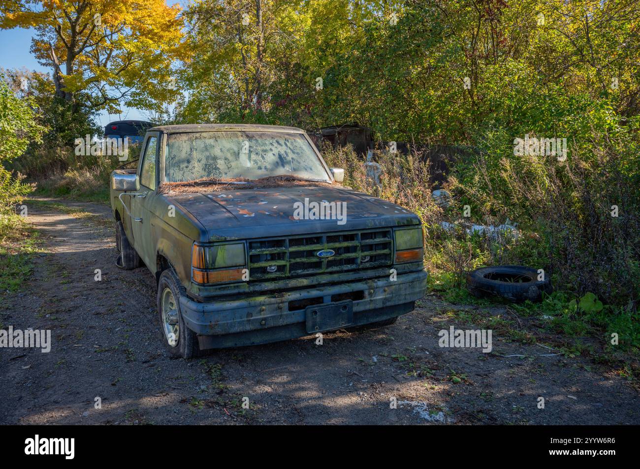 old Ford Ranger pick-up truck abandoned on pathway in junk yard Stock ...