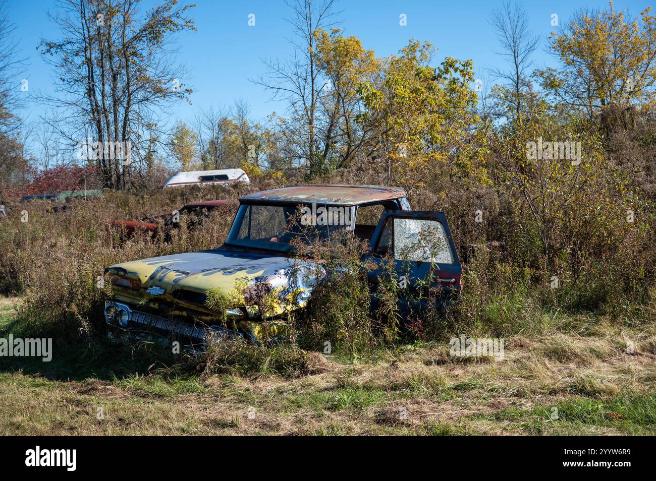 Old pick-up truck sitting in junk yard field Stock Photo - Alamy
