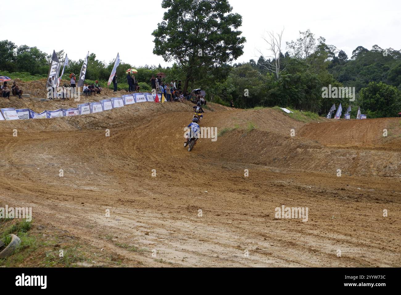Motocross racers in action on the motocross racing circuit Stock Photo ...