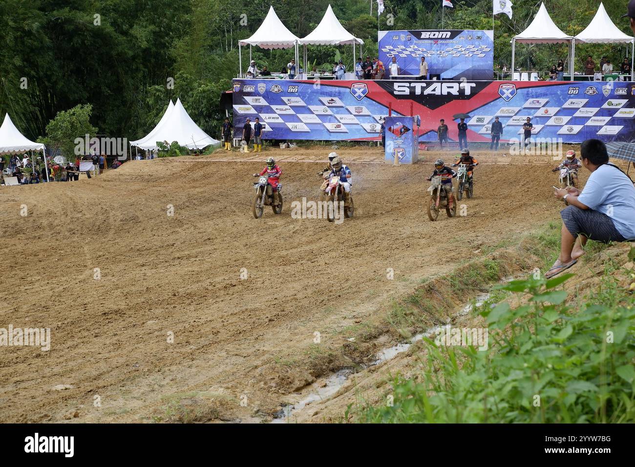 Motocross racers in action on the motocross racing circuit Stock Photo ...