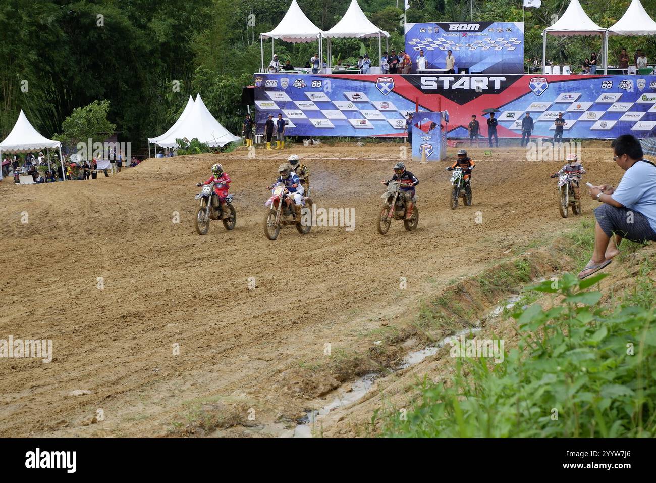 Motocross racers in action on the motocross racing circuit Stock Photo ...