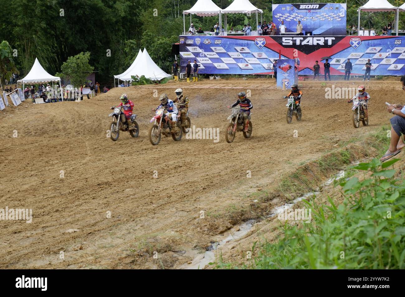 Motocross racers in action on the motocross racing circuit Stock Photo ...