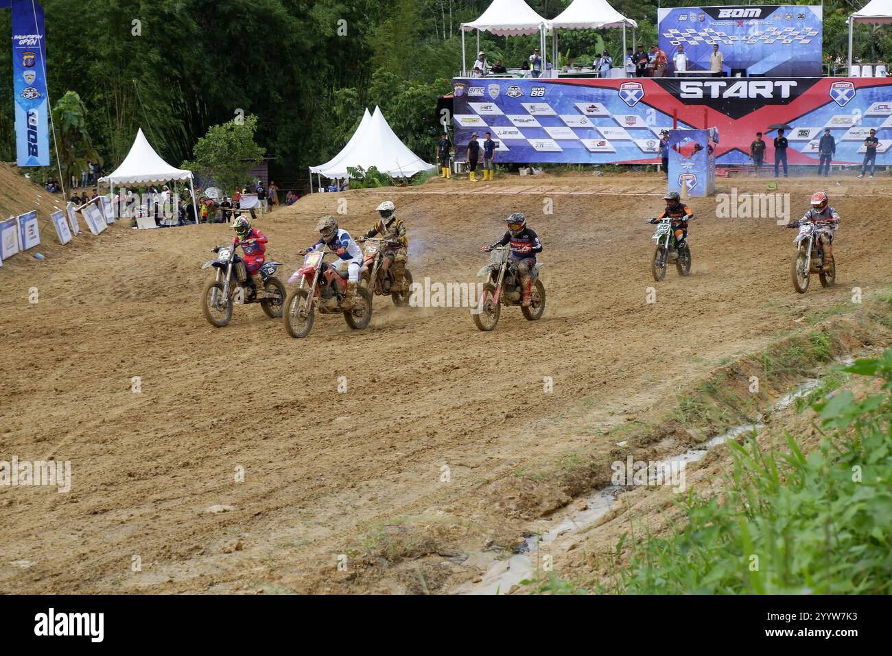 Motocross racers in action on the motocross racing circuit Stock Photo ...