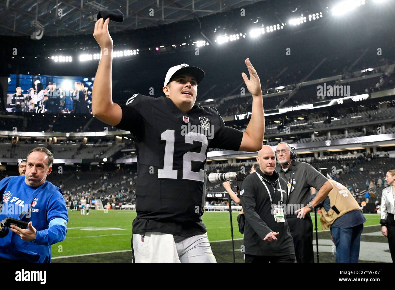 Las Vegas Raiders quarterback Aidan O'Connell smiles as he waves to the ...