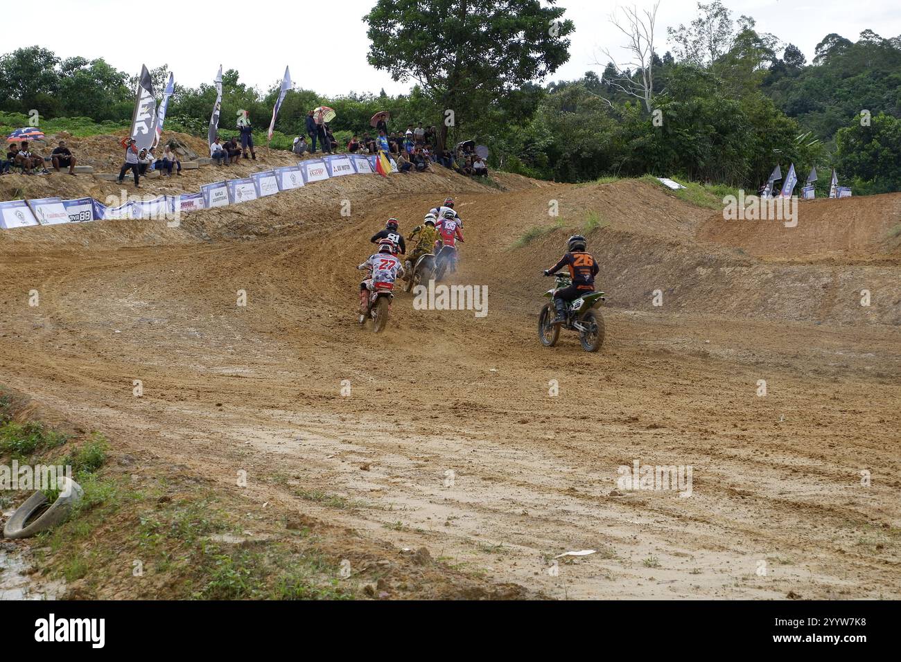 Motocross racers in action on the motocross racing circuit Stock Photo ...