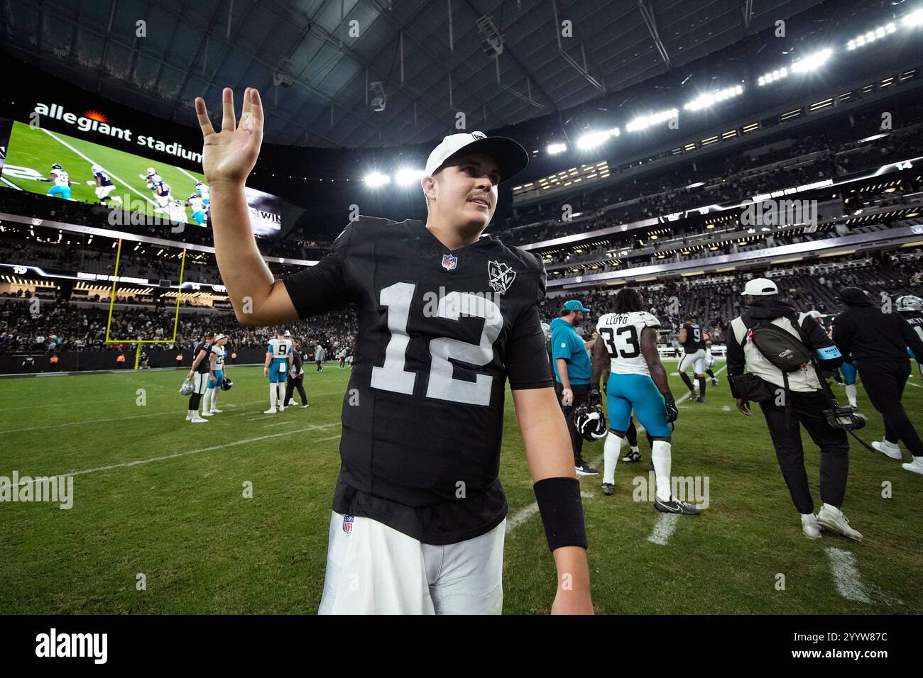 Las Vegas Raiders quarterback Aidan O'Connell waves to the crowd as he ...