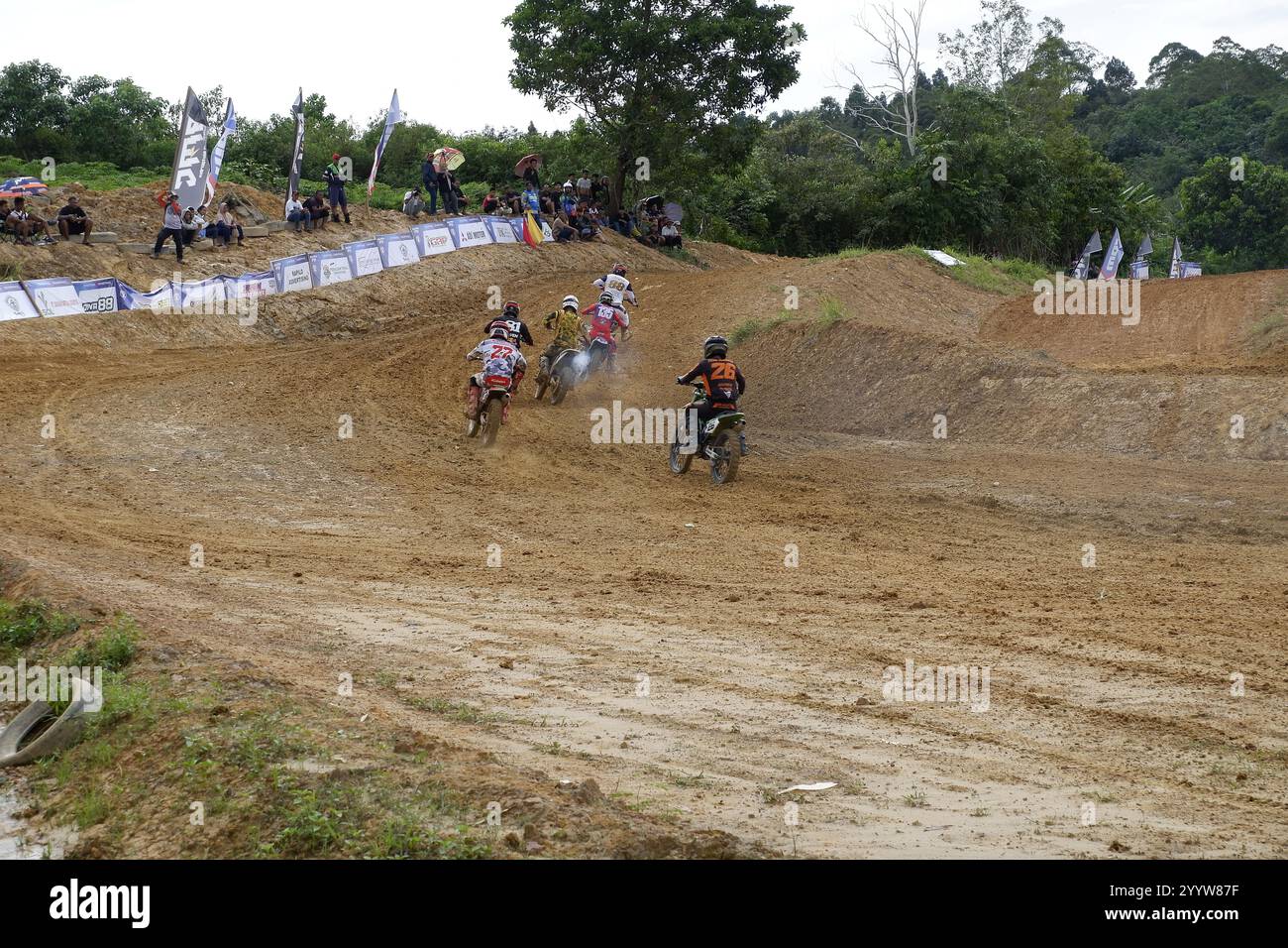 Motocross racers in action on the motocross racing circuit Stock Photo ...