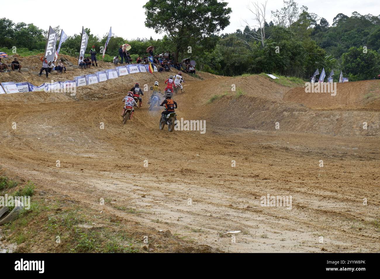 Motocross racers in action on the motocross racing circuit Stock Photo ...