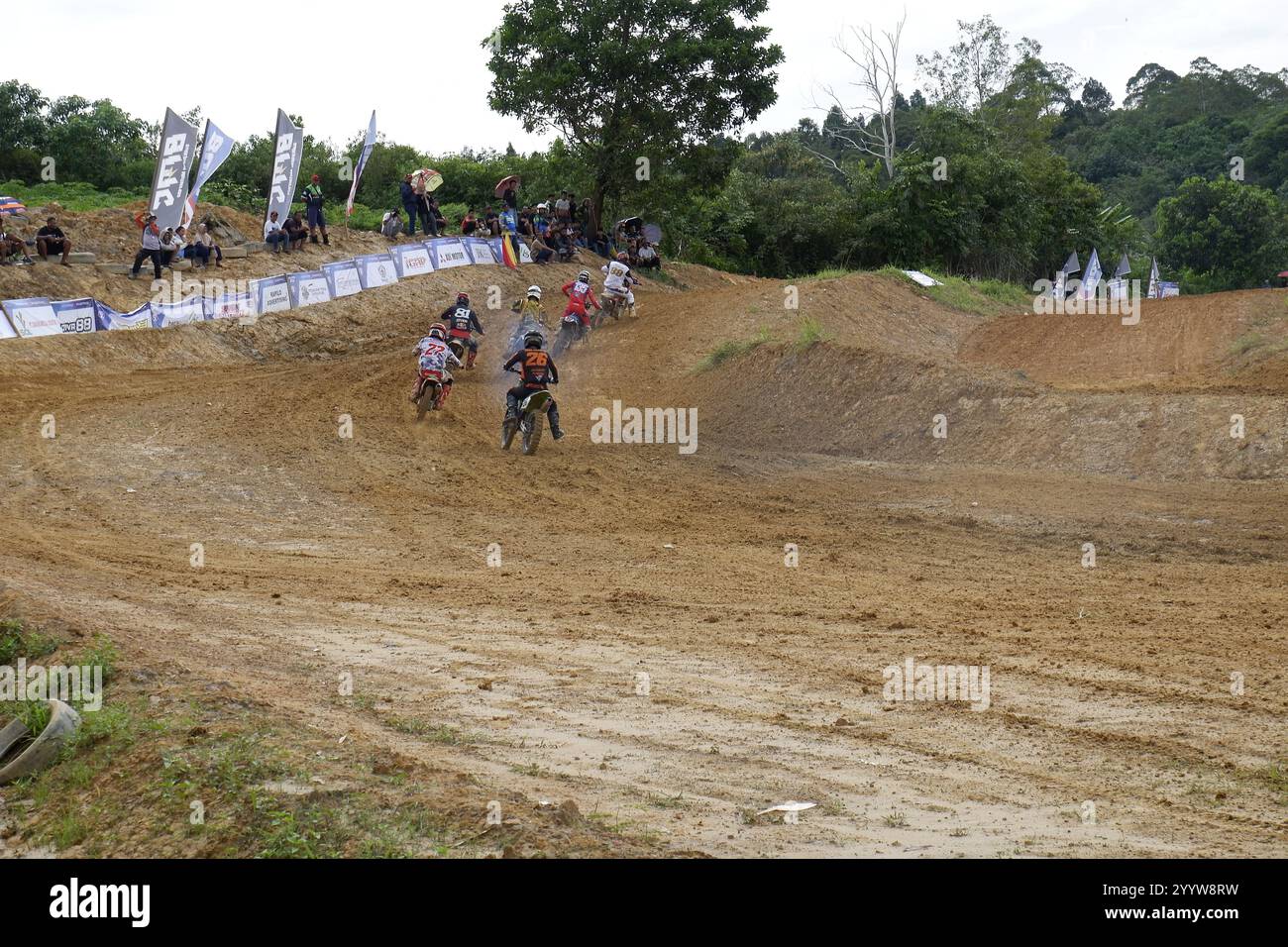 Motocross racers in action on the motocross racing circuit Stock Photo ...