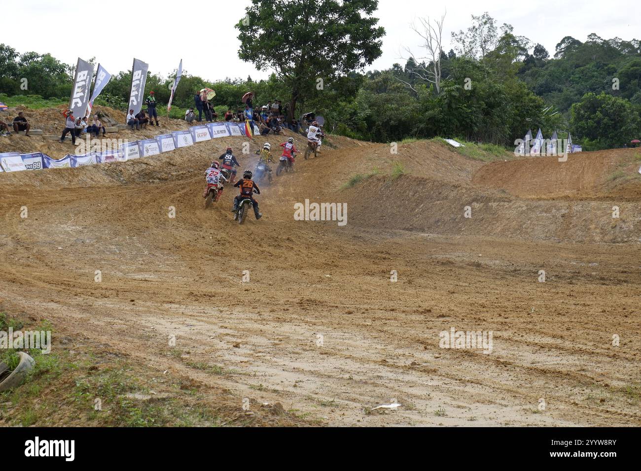Motocross racers in action on the motocross racing circuit Stock Photo ...