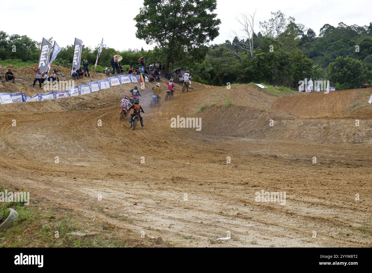 Motocross racers in action on the motocross racing circuit Stock Photo ...