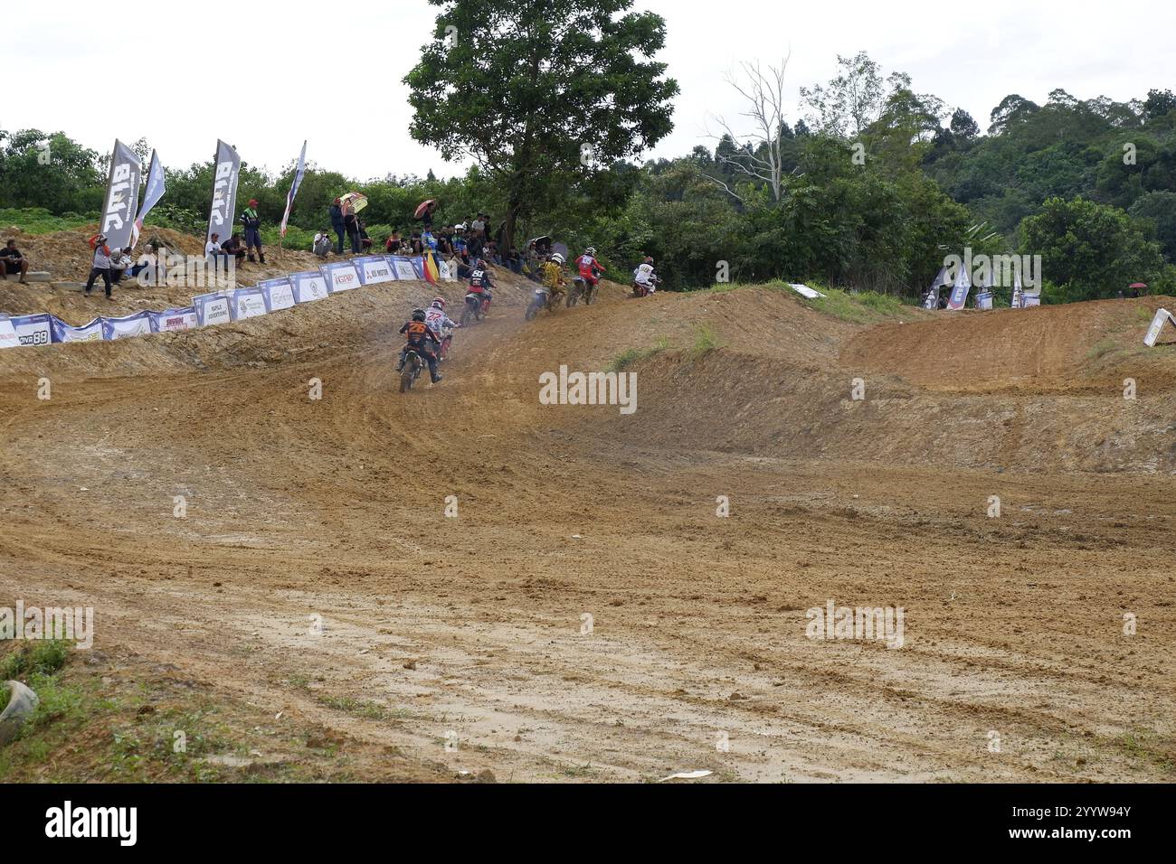 Motocross racers in action on the motocross racing circuit Stock Photo ...