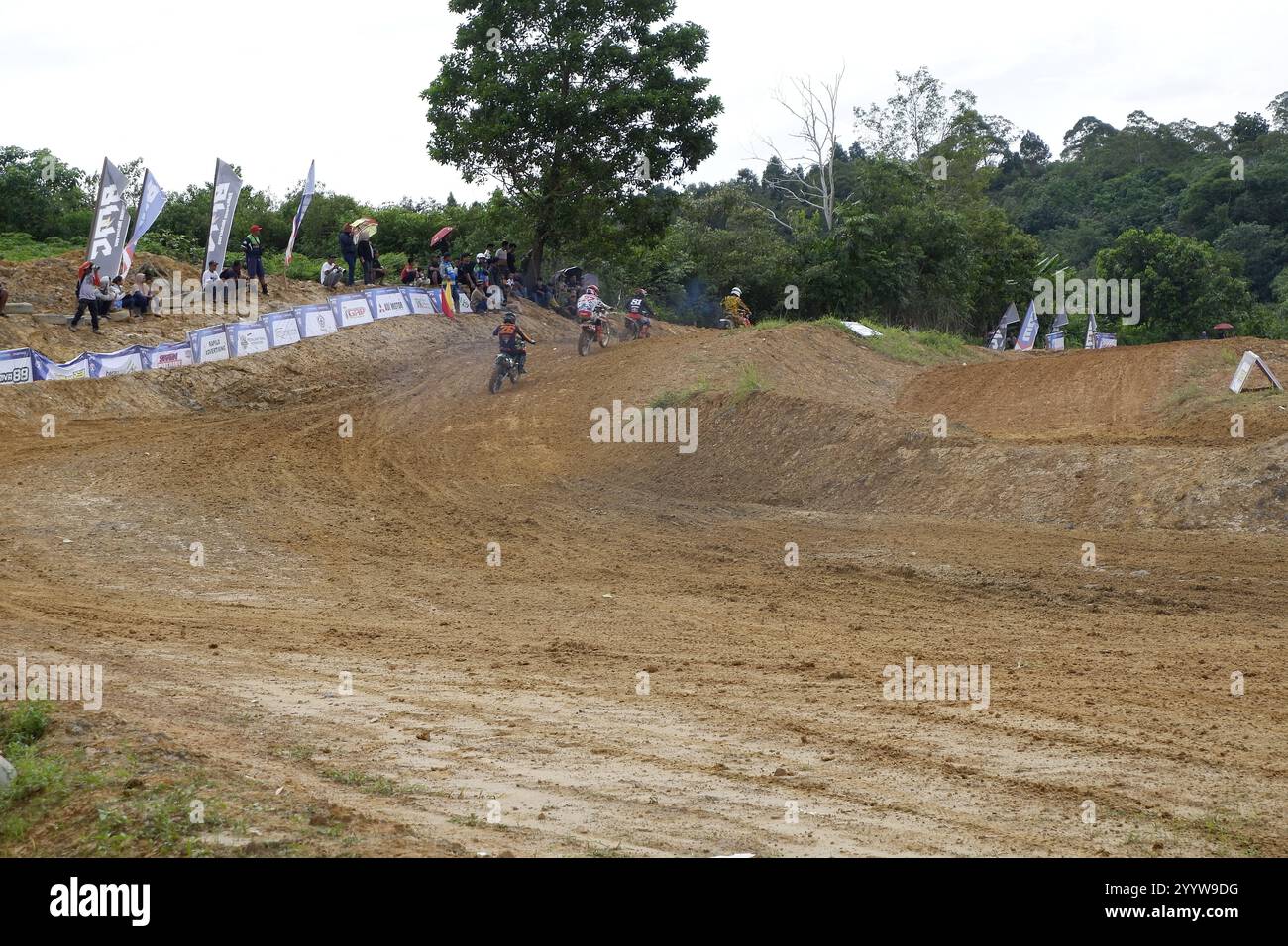 Motocross racers in action on the motocross racing circuit Stock Photo ...