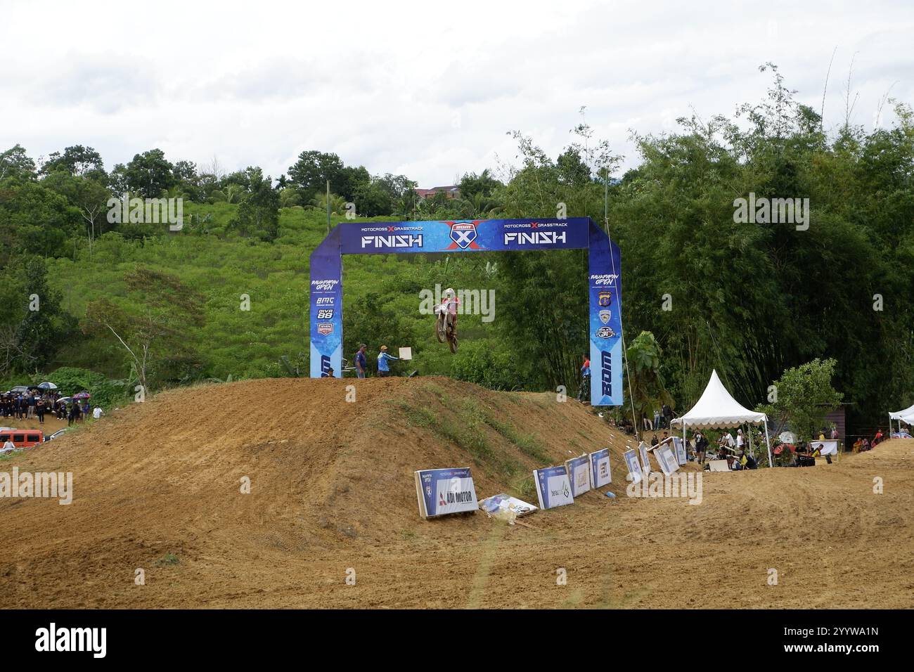 Motocross racers in action on the motocross racing circuit Stock Photo ...