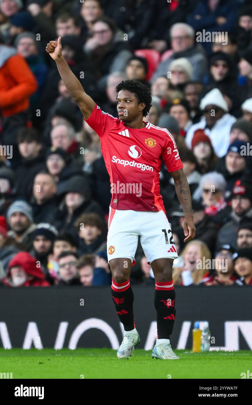 Tyrell Malacia of Manchester United gives the thumbs up to a team mate ...