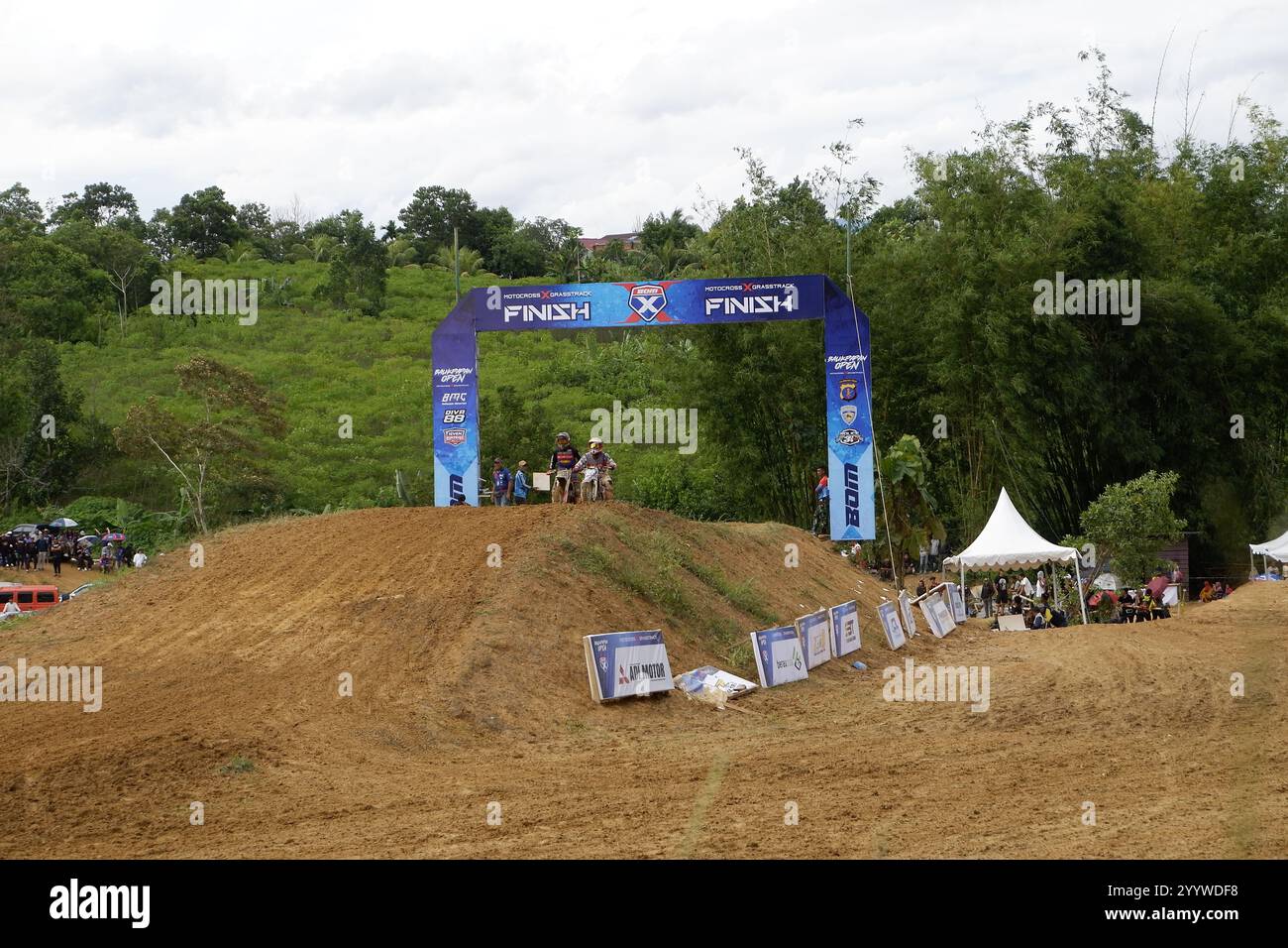 Motocross racers in action on the motocross racing circuit Stock Photo ...