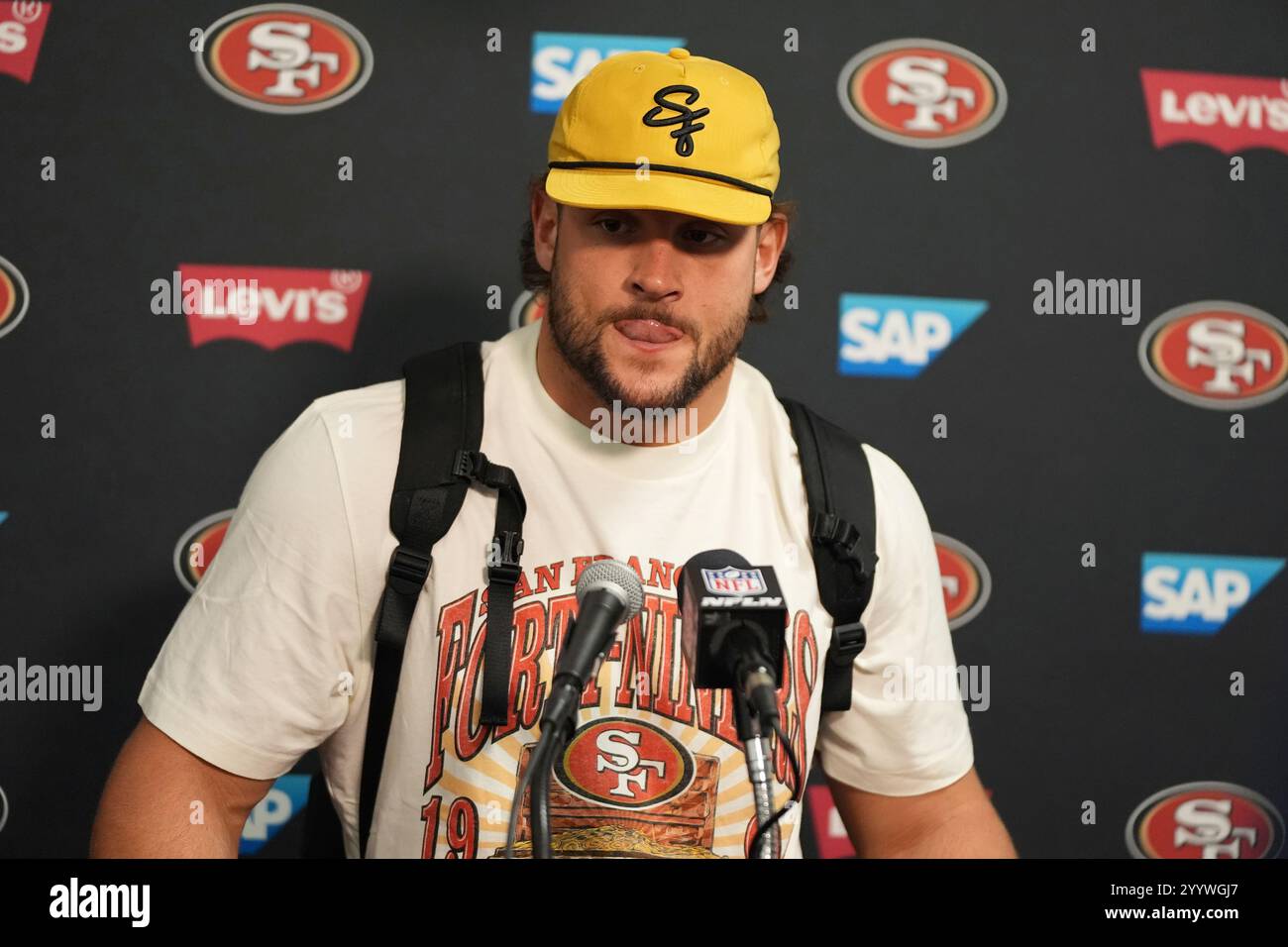 San Francisco 49ers defensive end Nick Bosa (97) reacts to a question ...