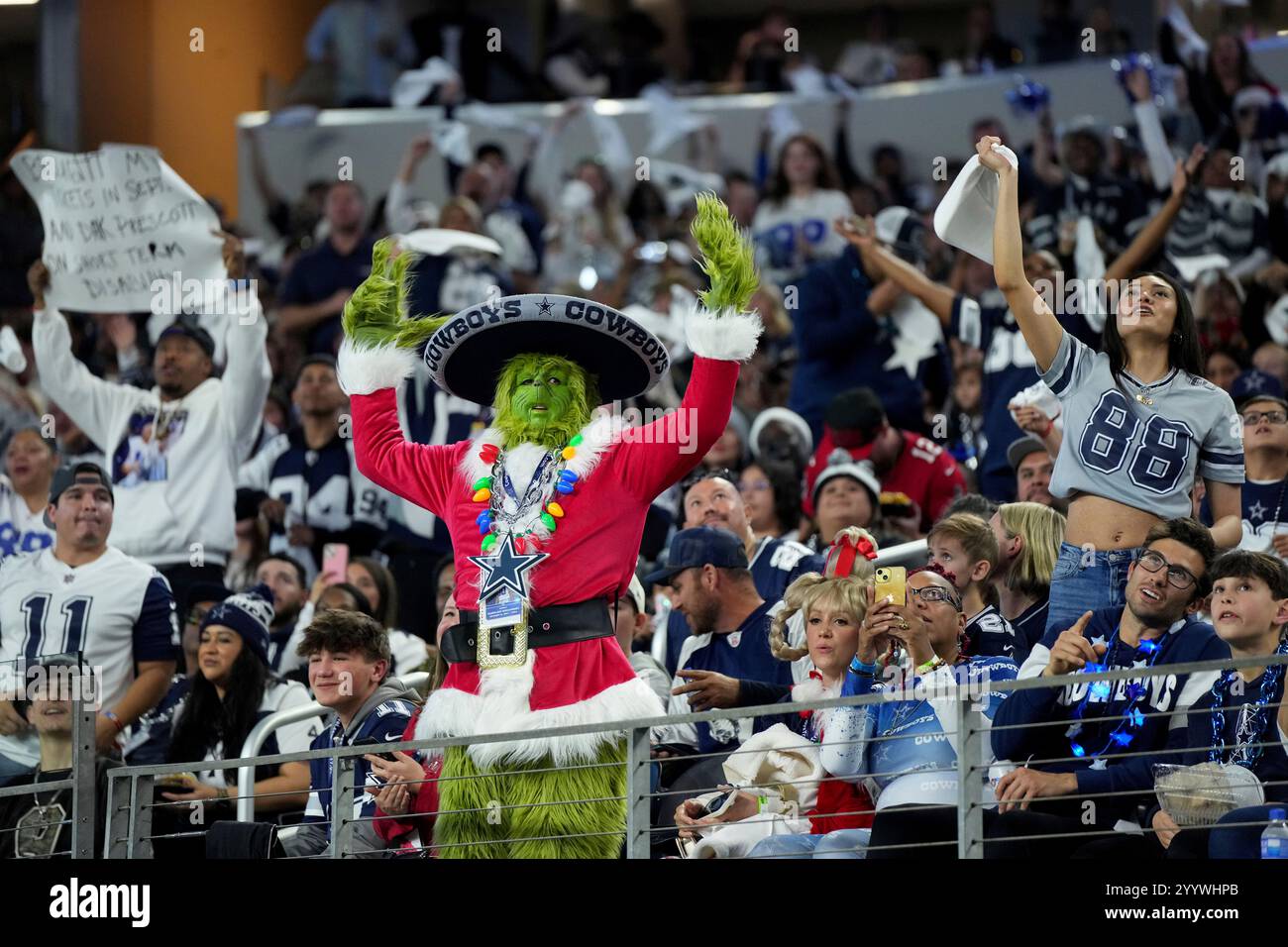 Dallas Cowboys fan Chris Raiser, center in holiday costume, and others ...