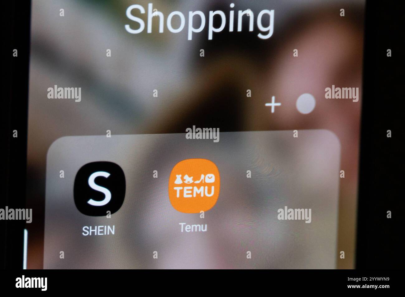 Shein and Temu icons are seen displayed on a phone screen in this ...
