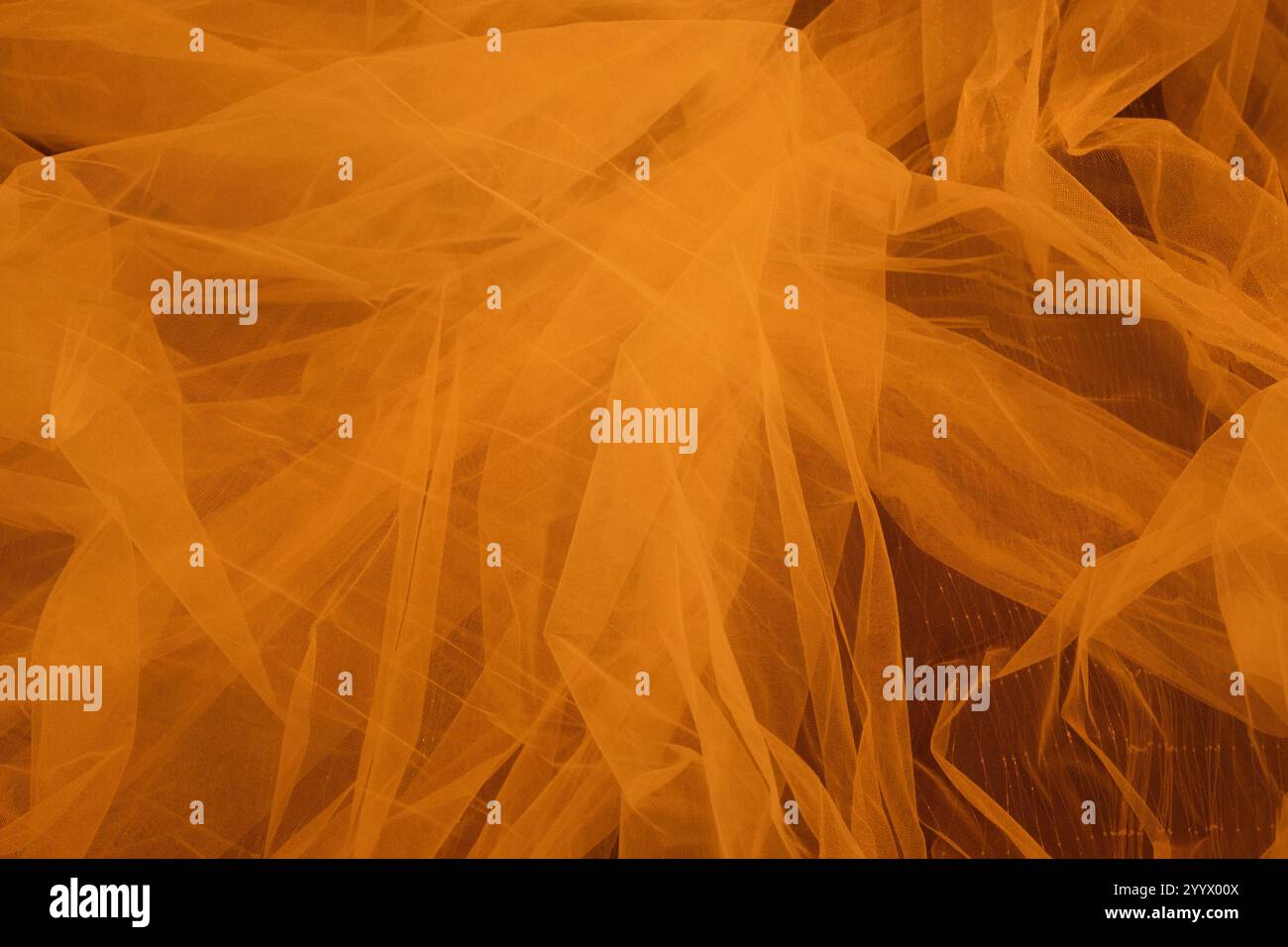 Delicate folds of sheer orange fabric create a dynamic and layered ...