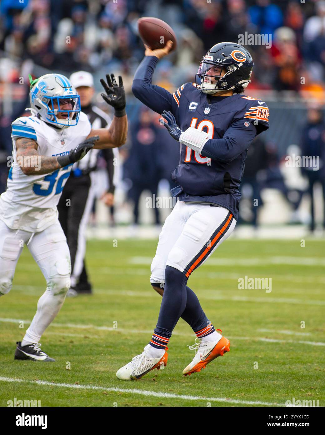 Chicago Bears quarterback Caleb Williams (18) is chased by Detroit ...