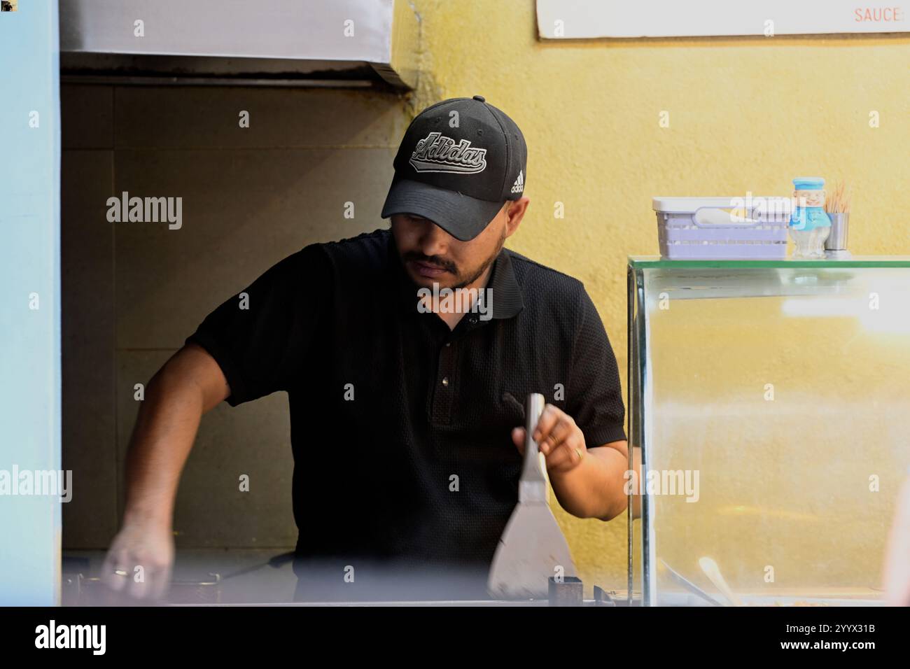 A Nepali chef working in his fast food restaurant in Thamel, Kathmandu ...