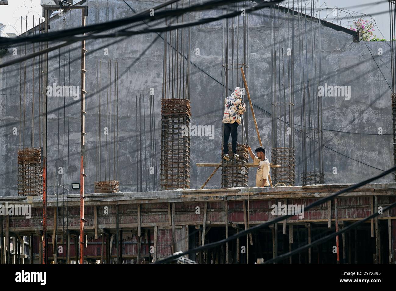 Young Nepali men working at a construction site in Thamel, Kathmandu ...