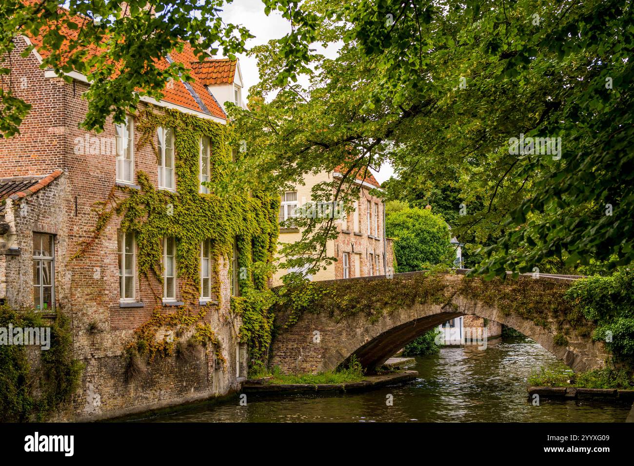 Medieval stone bridge on canal, on canal, Bruges, West Flanders ...