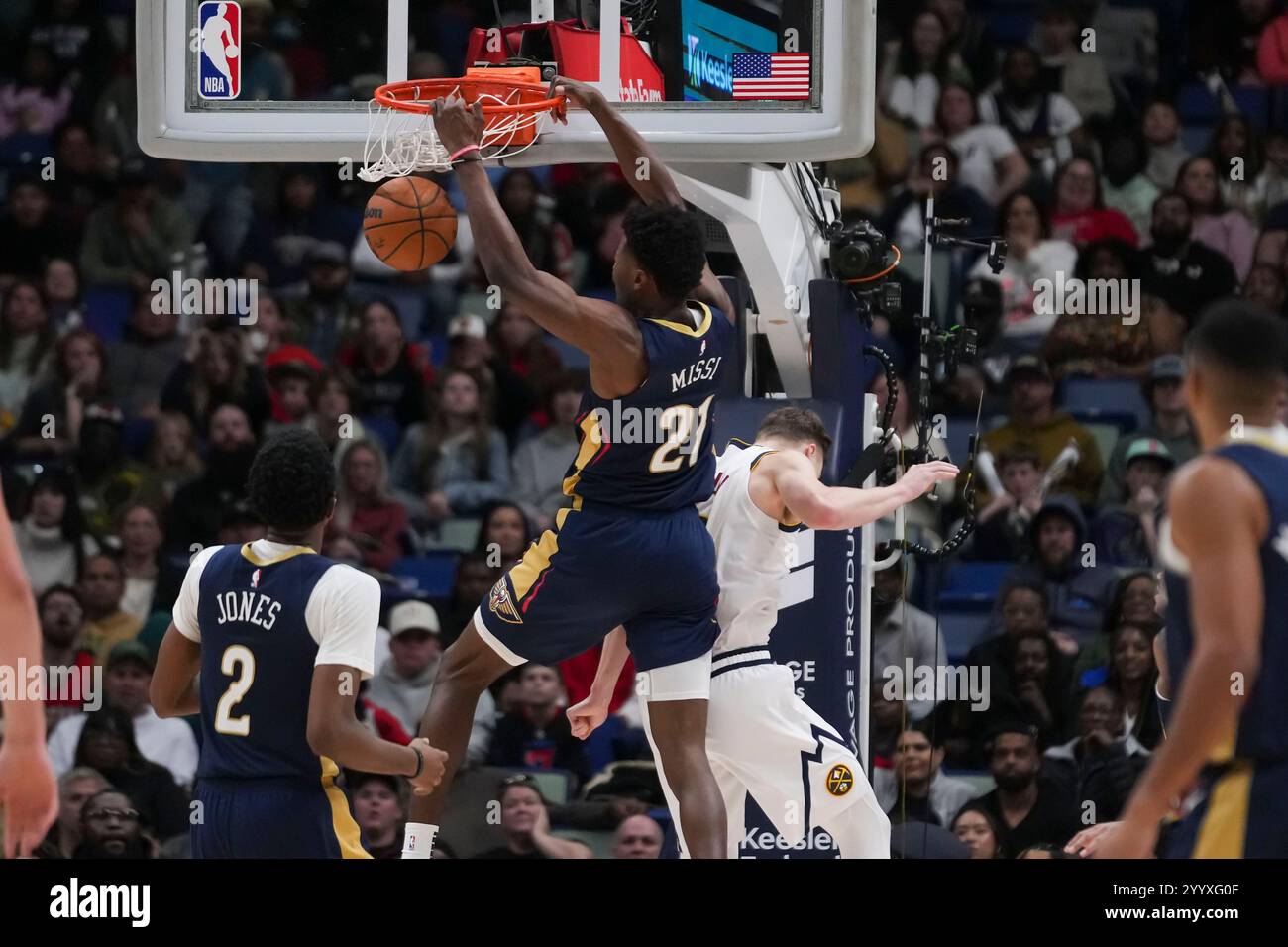 New Orleans Pelicans center Yves Missi (21) slam dunks over Denver ...