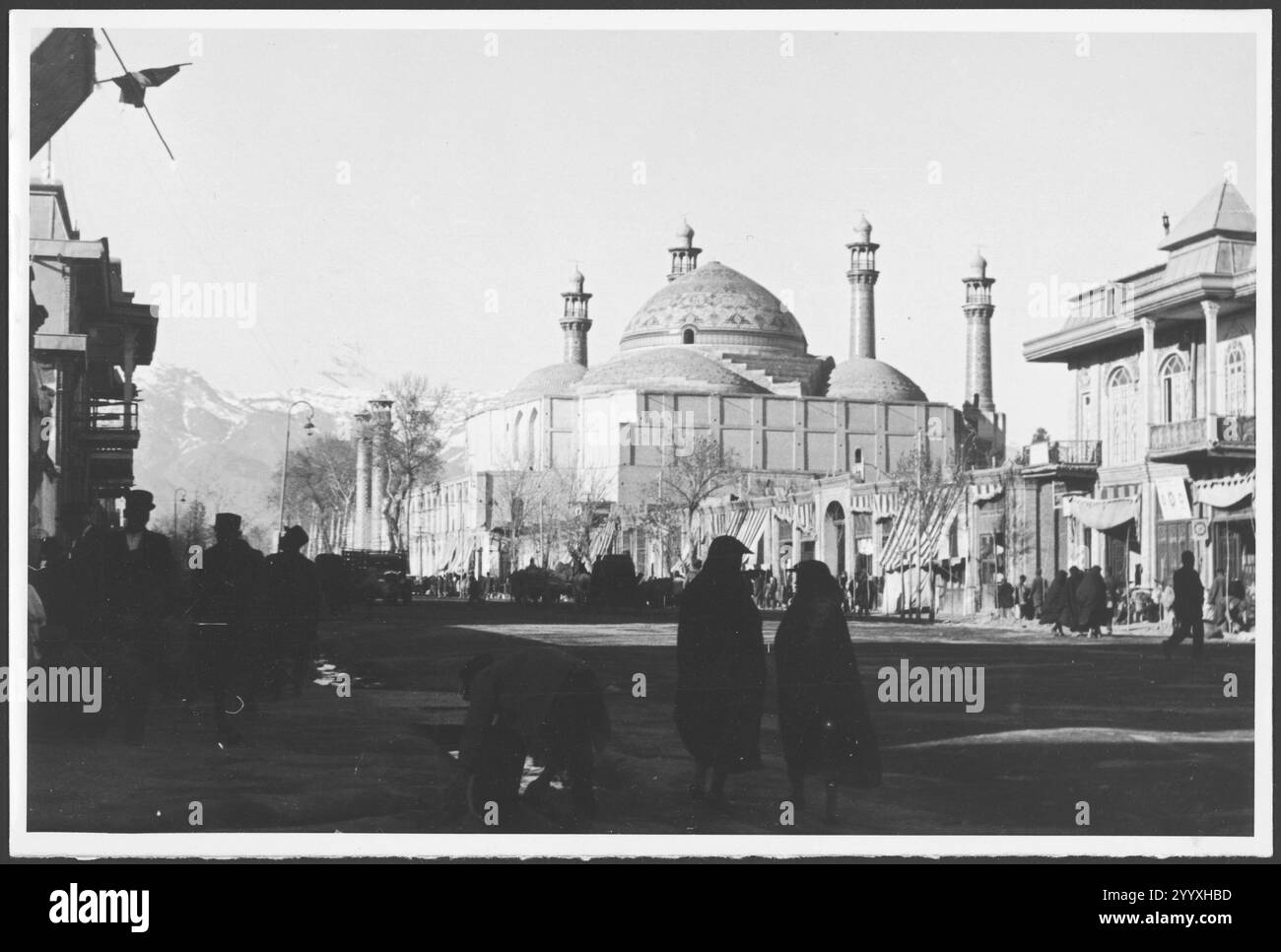 Persia, Tehran: Mosque; A row of houses on a street, a mosque in the ...