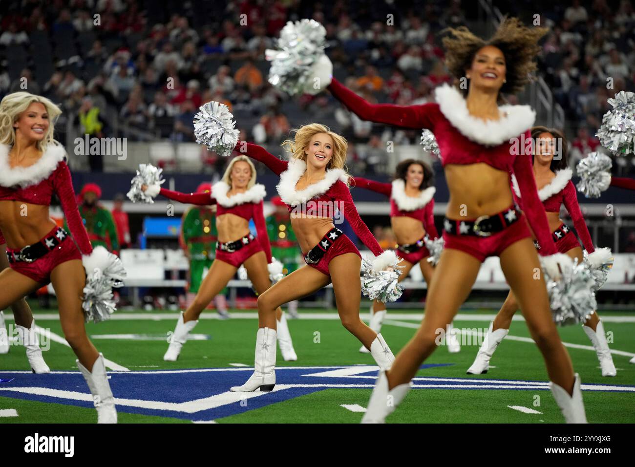 The Dallas Cowboys Cheerleader perform in their holiday costumes at halftime of an NFL football ...