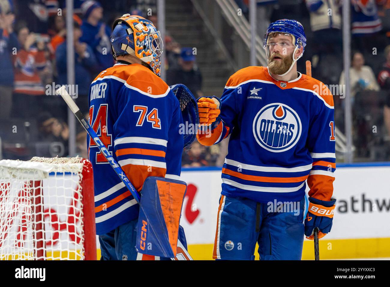 Edmonton Oilers' Stuart Skinner (74) and Mattias Ekholm, right ...