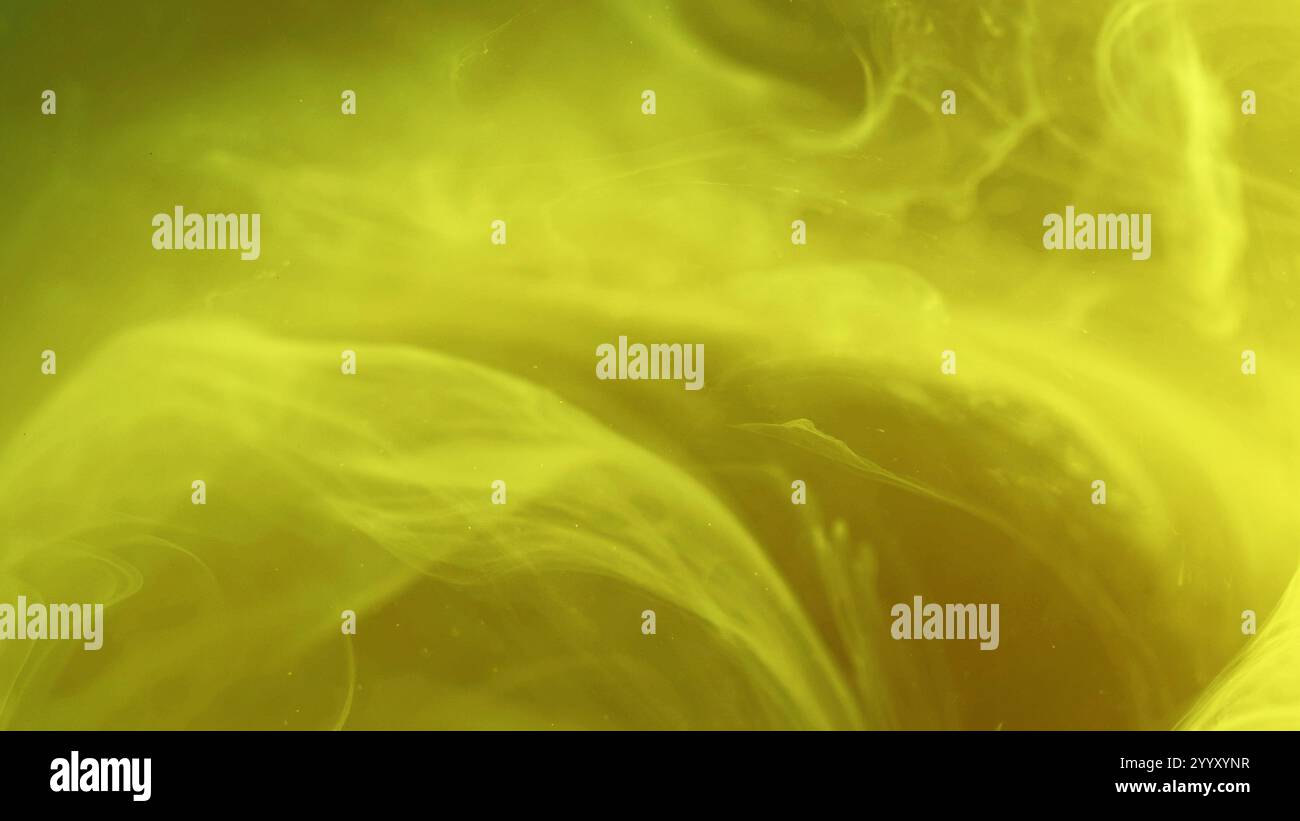 Paint floating. Shiny smoke. Defocused bright yellow colorful vapor ...