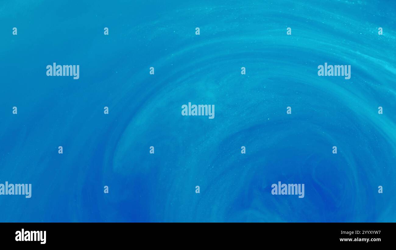 Sparkling flow. Mixing paint. Defocused bright blue splash ink mist ...