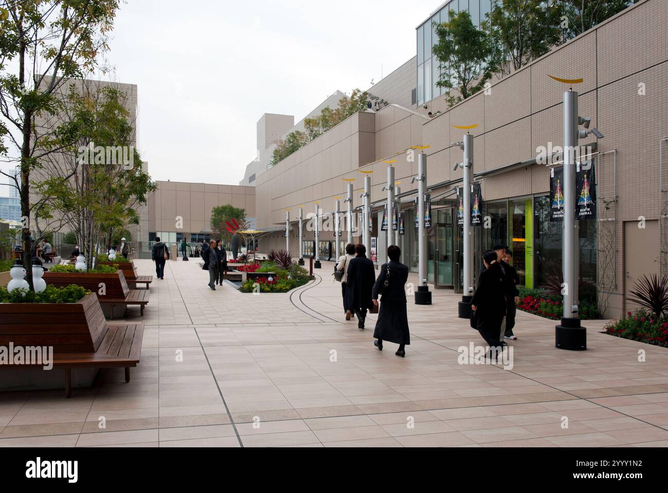 Visitors passing through an intermediate plaza level of the West Japan ...