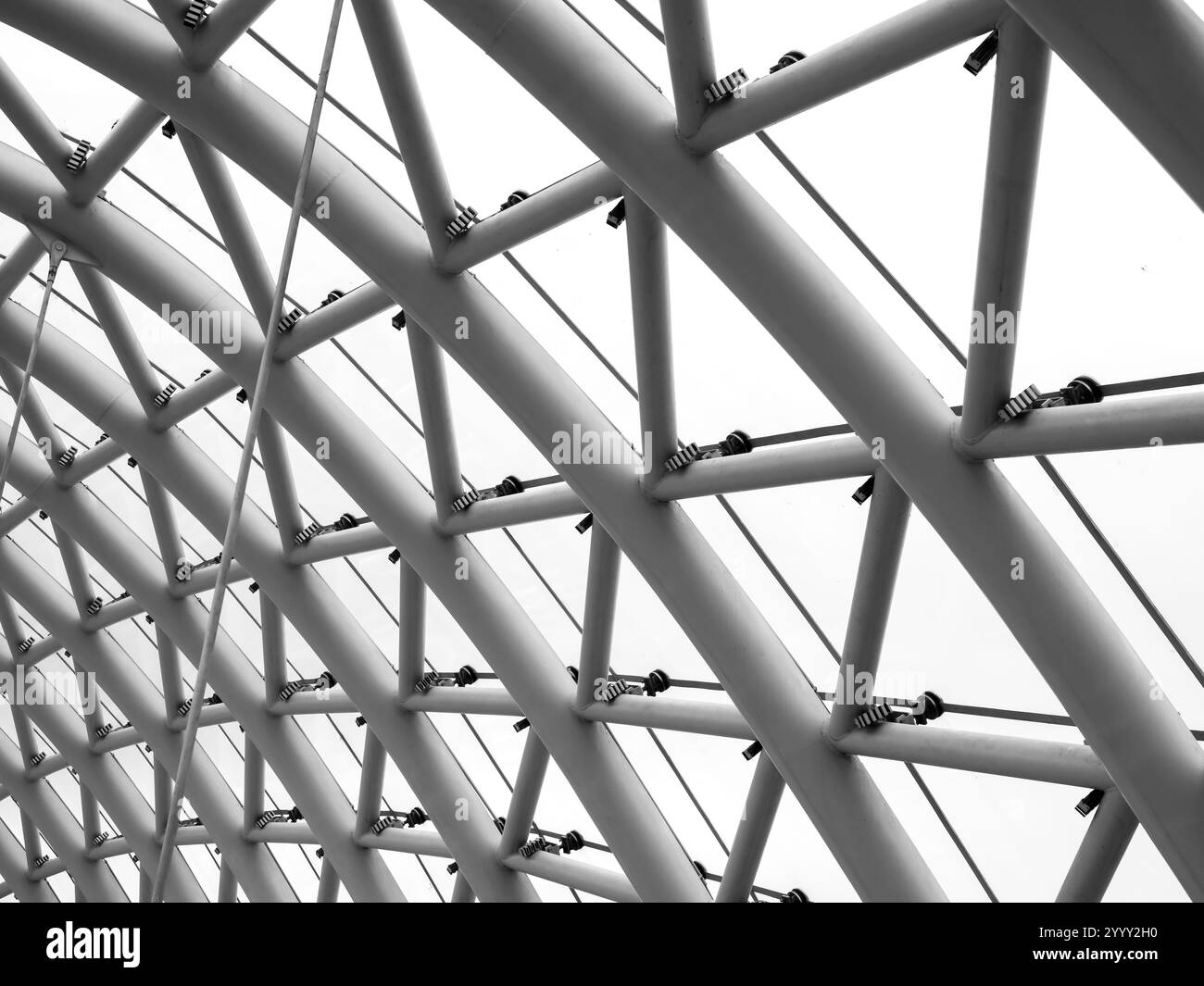 Abstract curved modern construction on the arch ceiling of the bridge ...