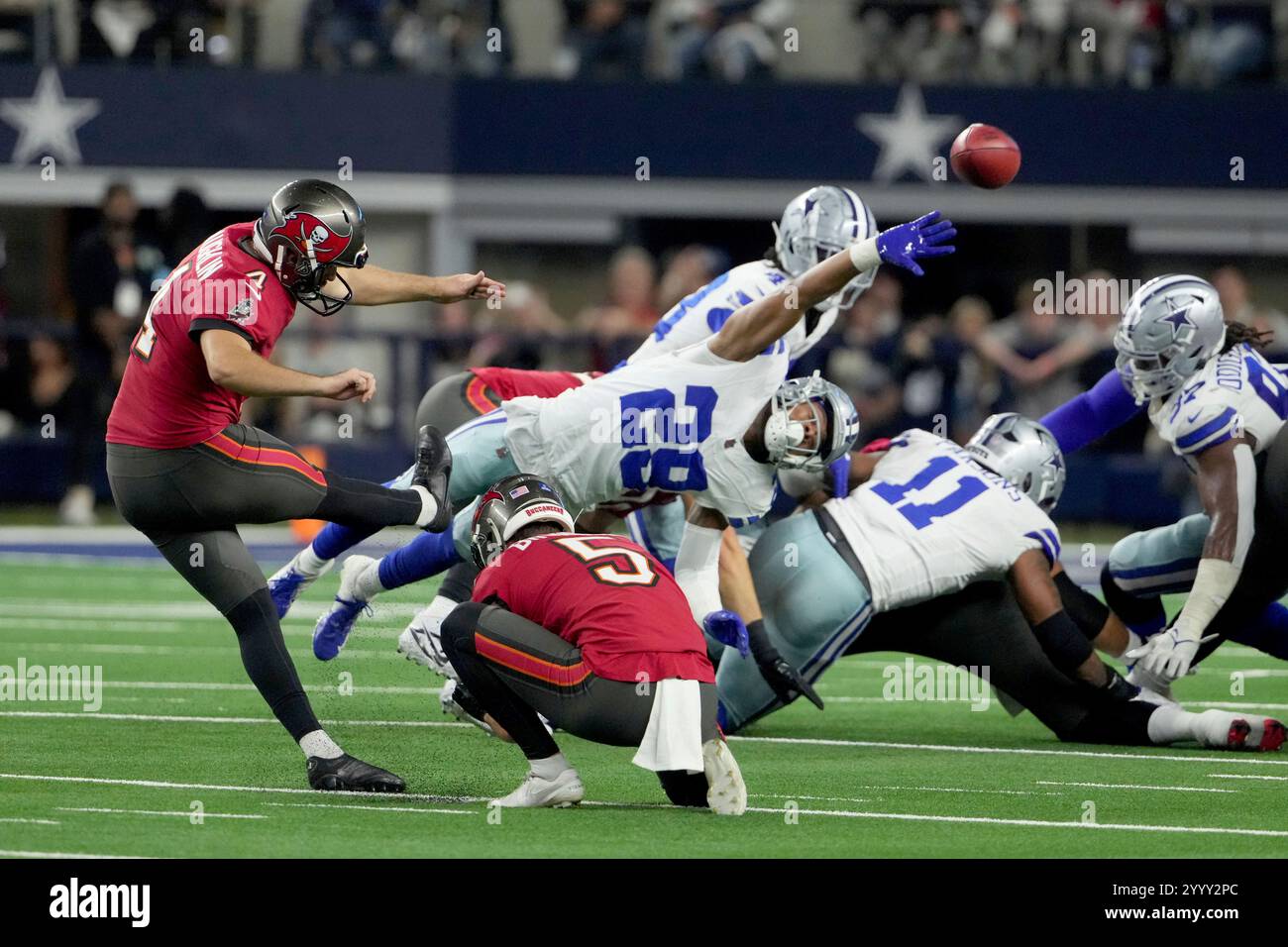 Tampa Bay Buccaneers place kicker Chase McLaughlin (4) kicks a field goal as Jack Browning (5 ...
