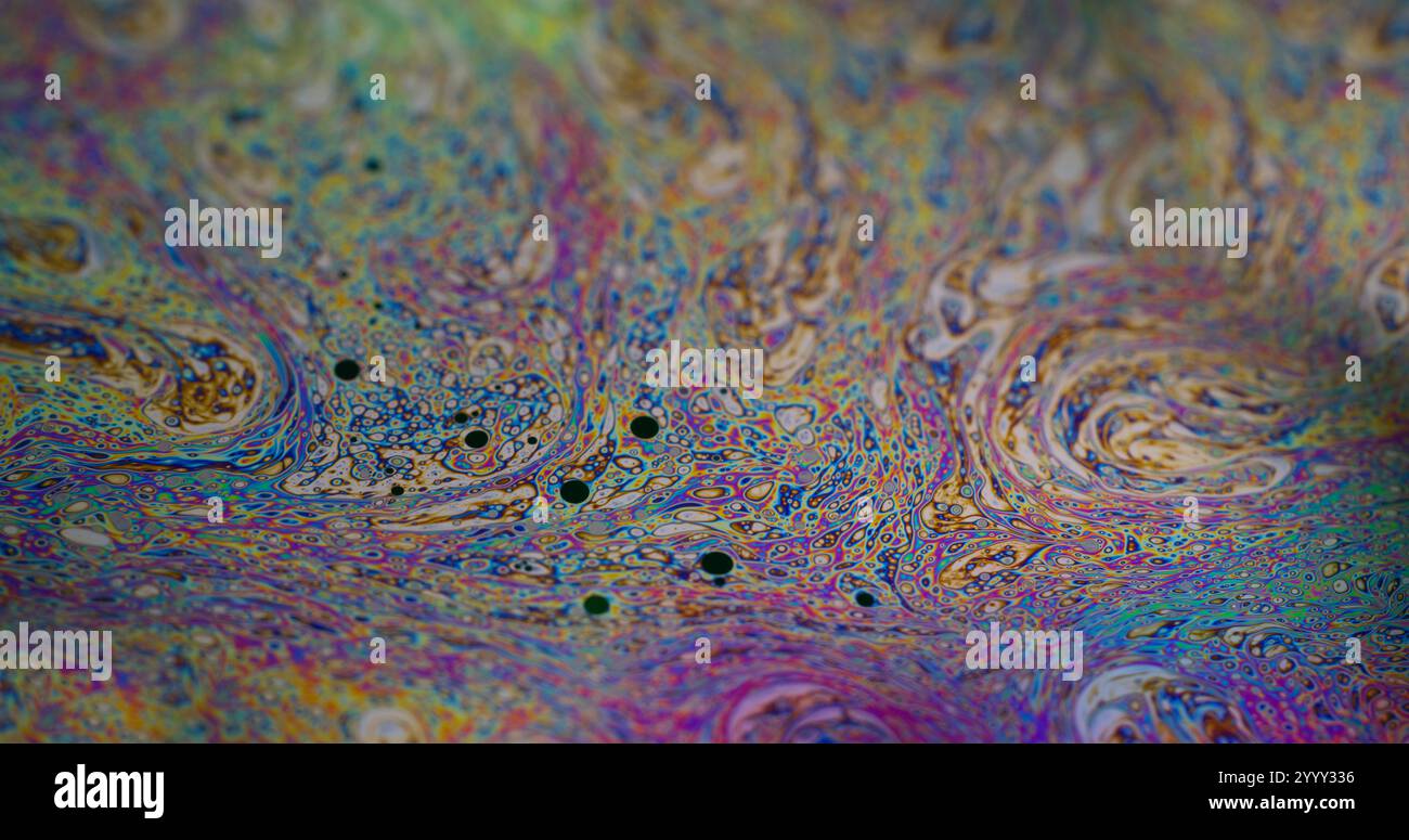 Rainbow curve. Acrylic slick. Defocused multicolor purple green liquid ...