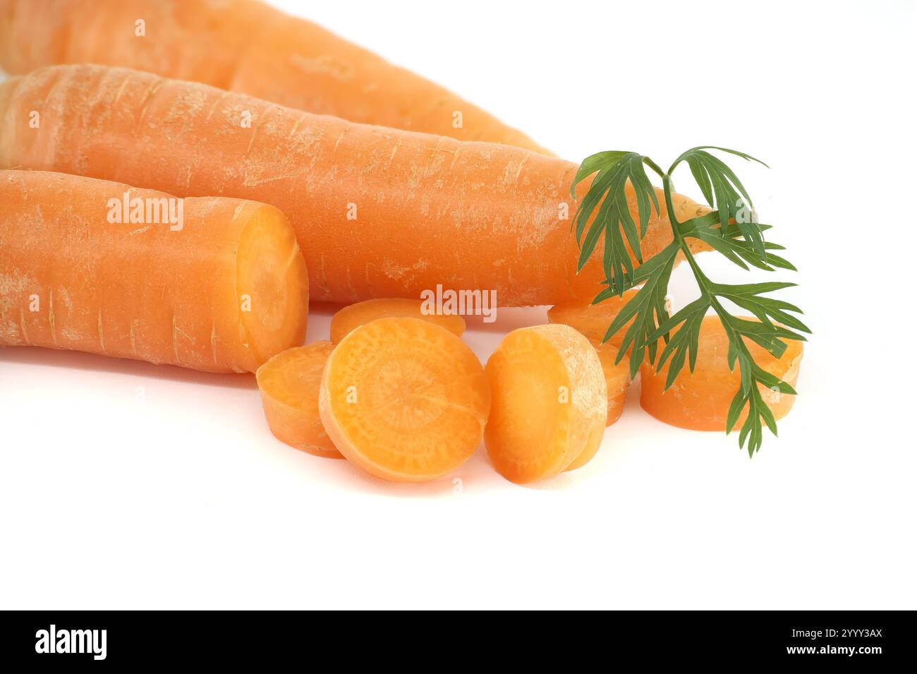 Discover the vibrant beauty of fresh carrots, sliced and whole ...