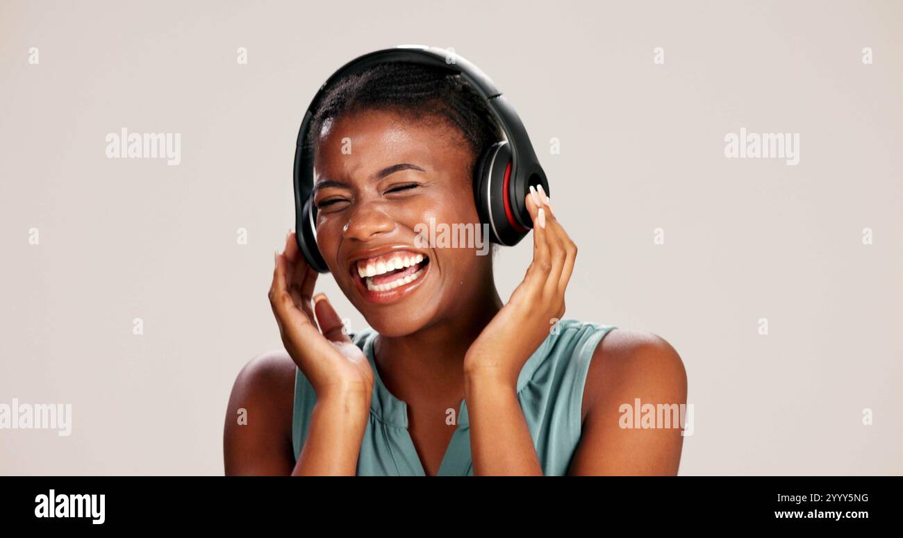 Music, girl and laughing with headphones on studio background for ...