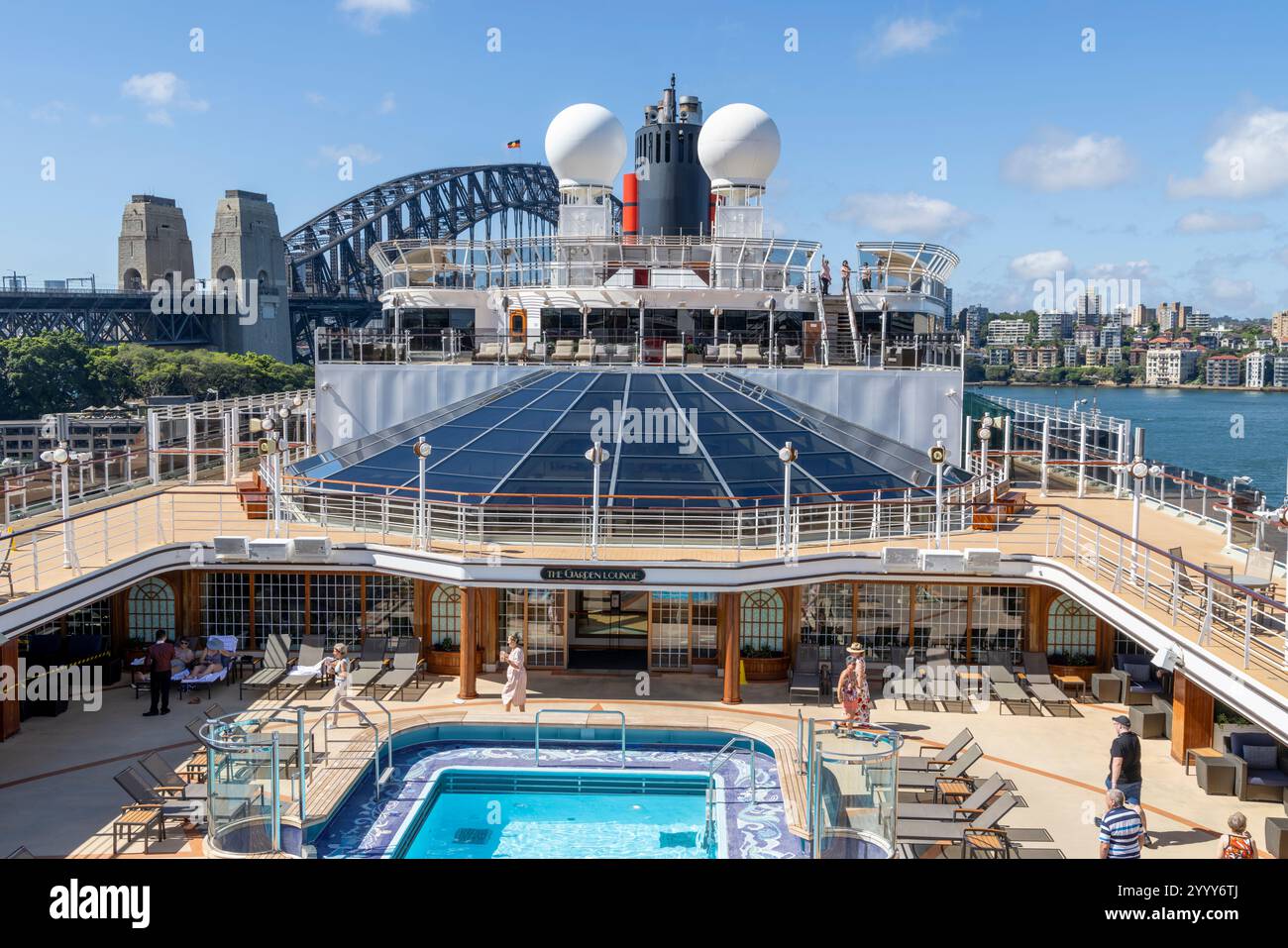 Cunard Queen Elizabeth cruise ship moored in Sydney Circular Quay with view of Pavilion pool on ...