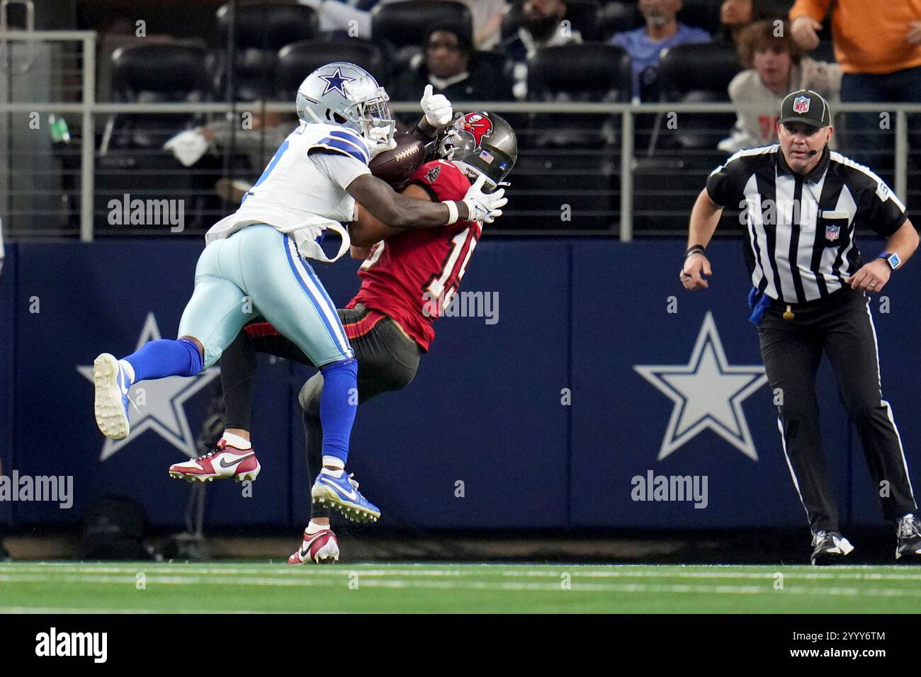 Dallas Cowboys cornerback Jourdan Lewis, left, comes down with an ...