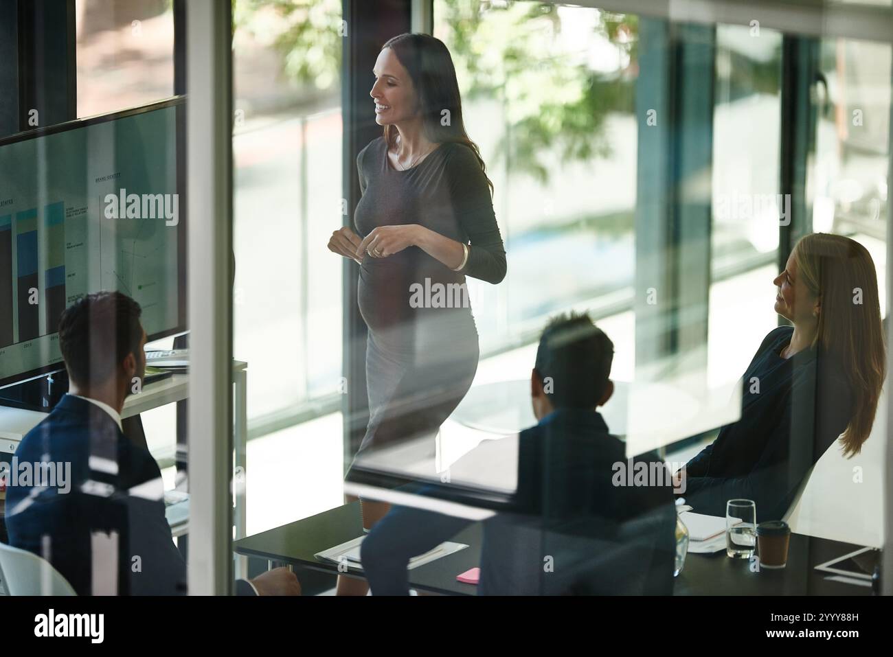 Pregnant woman, meeting and presentation with screen in boardroom for ...