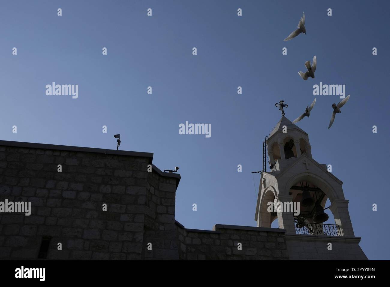 Birds fly above the Church of the Nativity, where Christians believe ...