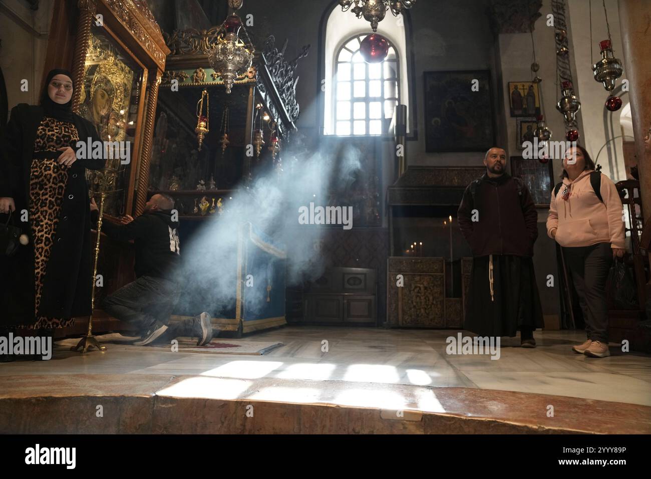 Worshippers visit the Church of the Nativity, where Christians believe ...