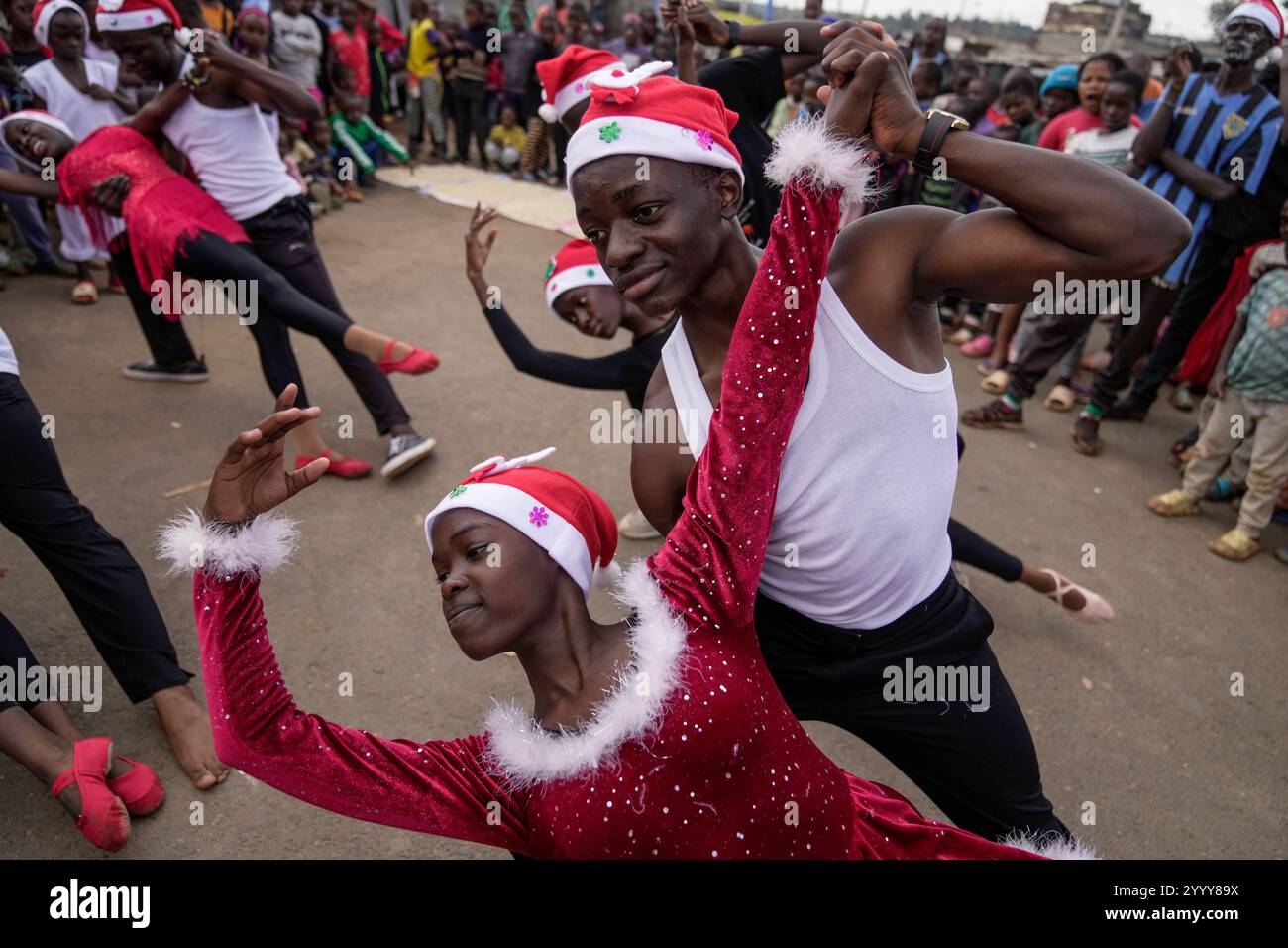 Young dancers perform, during a Christmas ballet event in Kibera slum ...