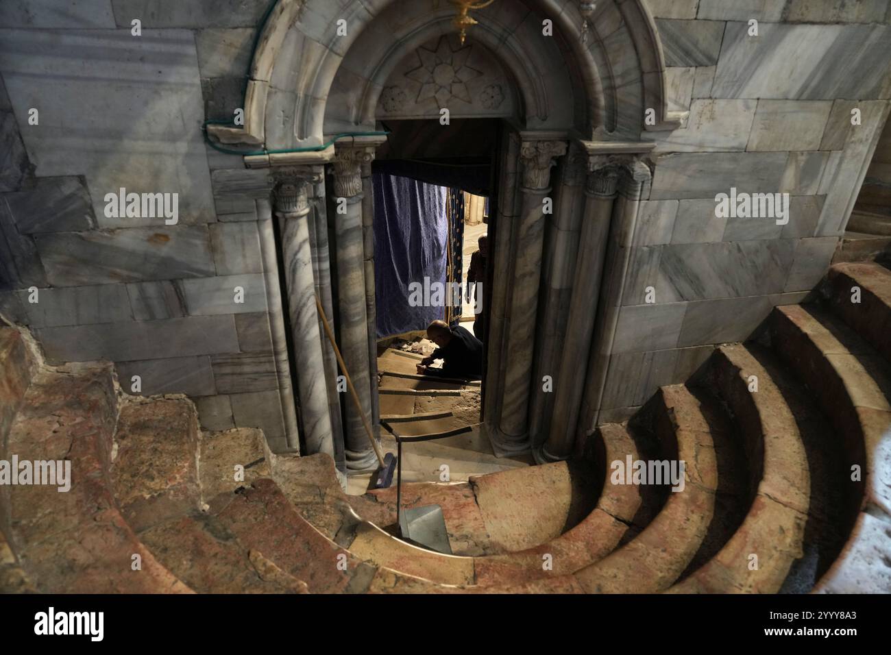 Workers tend to stairs in the Church of the Nativity, where Christians ...